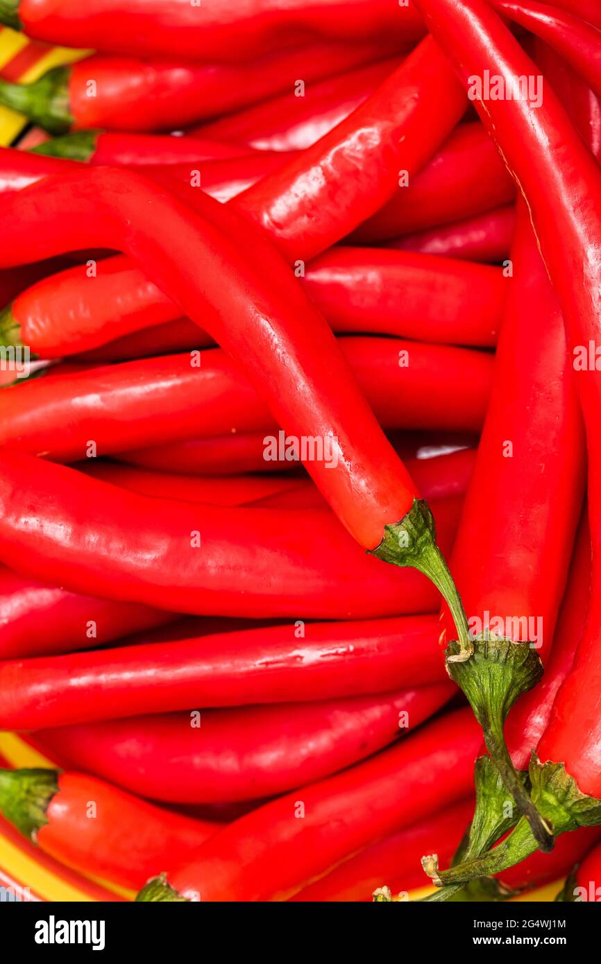Vertical shot of red hot chilli peppers background Stock Photo - Alamy