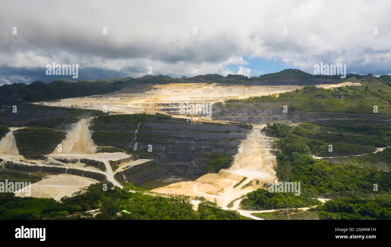 Open pit limestone quarry in the mountains of Bohol Island, Philippines ...