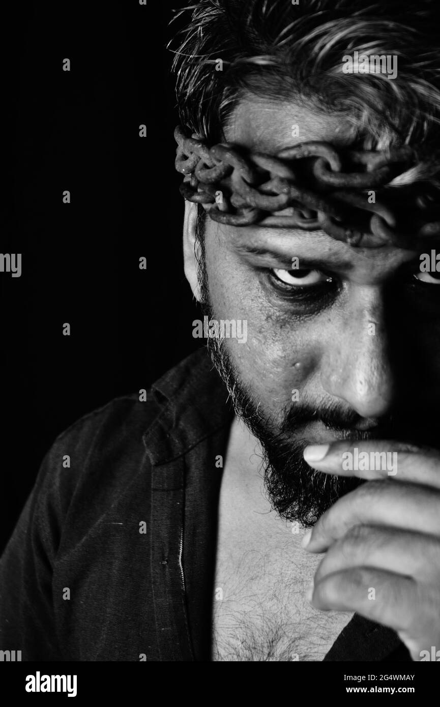 Black and white portrait of a South Asian man posing for a picture ...