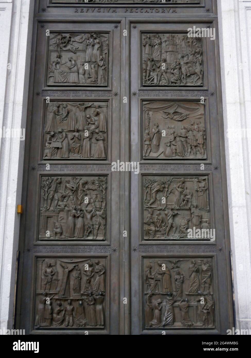 the decorated door of a Catholic church Stock Photo - Alamy