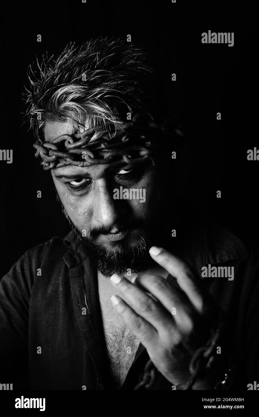 Black and white portrait of a South Asian man posing for a picture ...