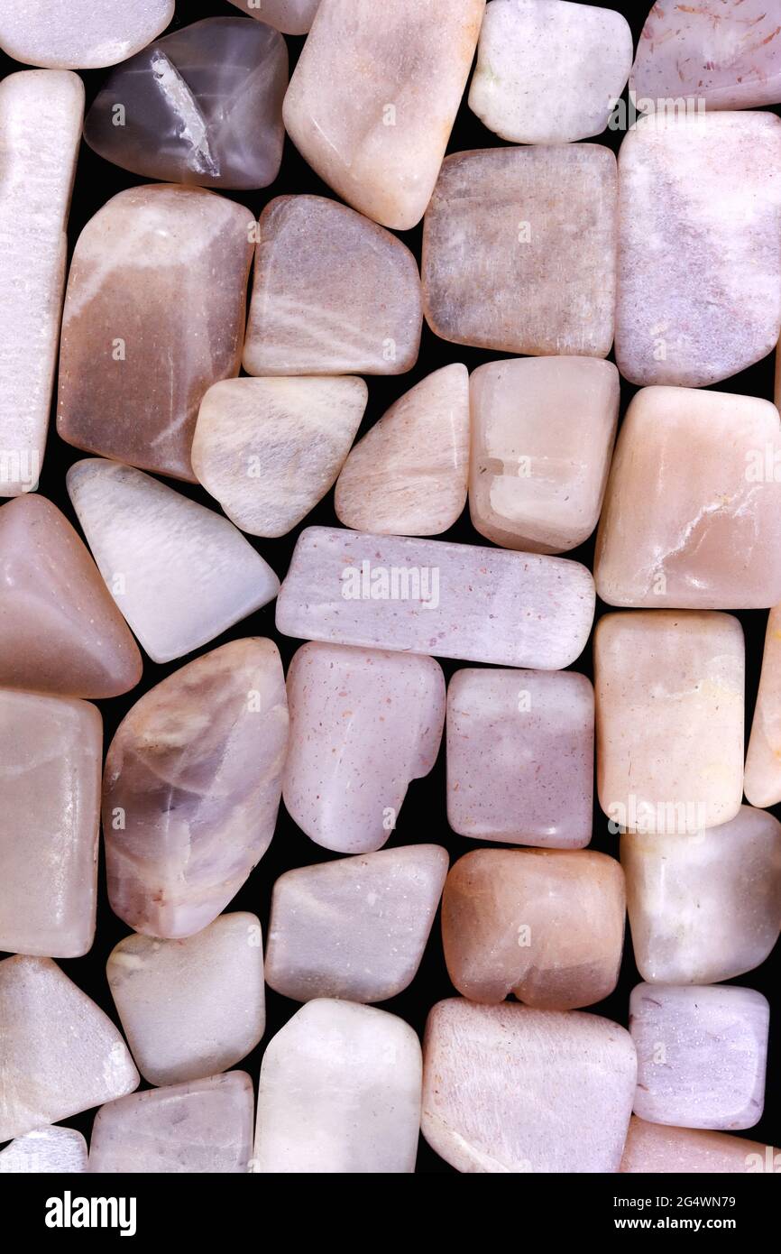 Sunstone heap jewel stones texture background. Pile mineral pebbles ...