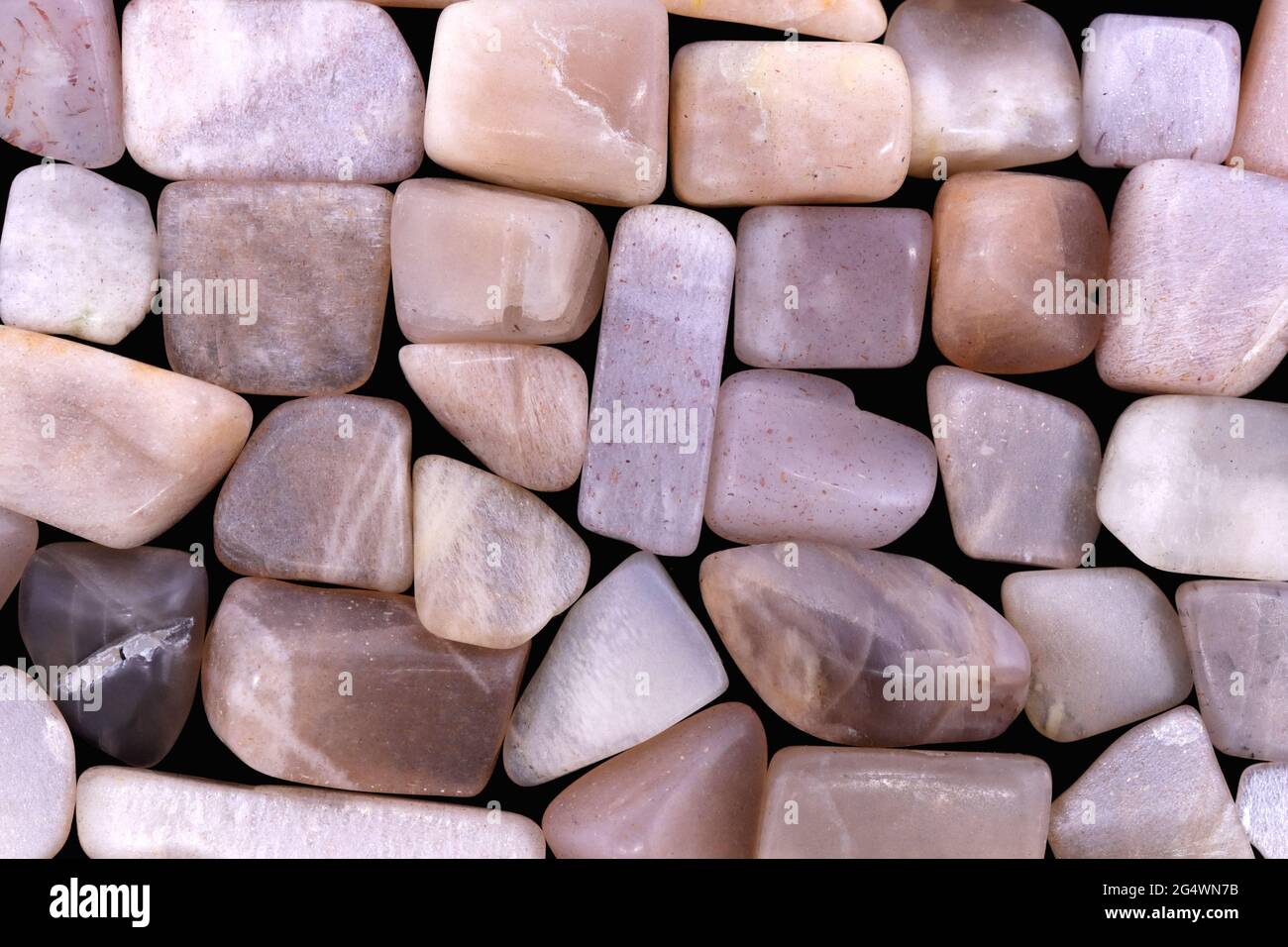 Sunstone heap jewel stones texture background. Pile mineral pebbles ...