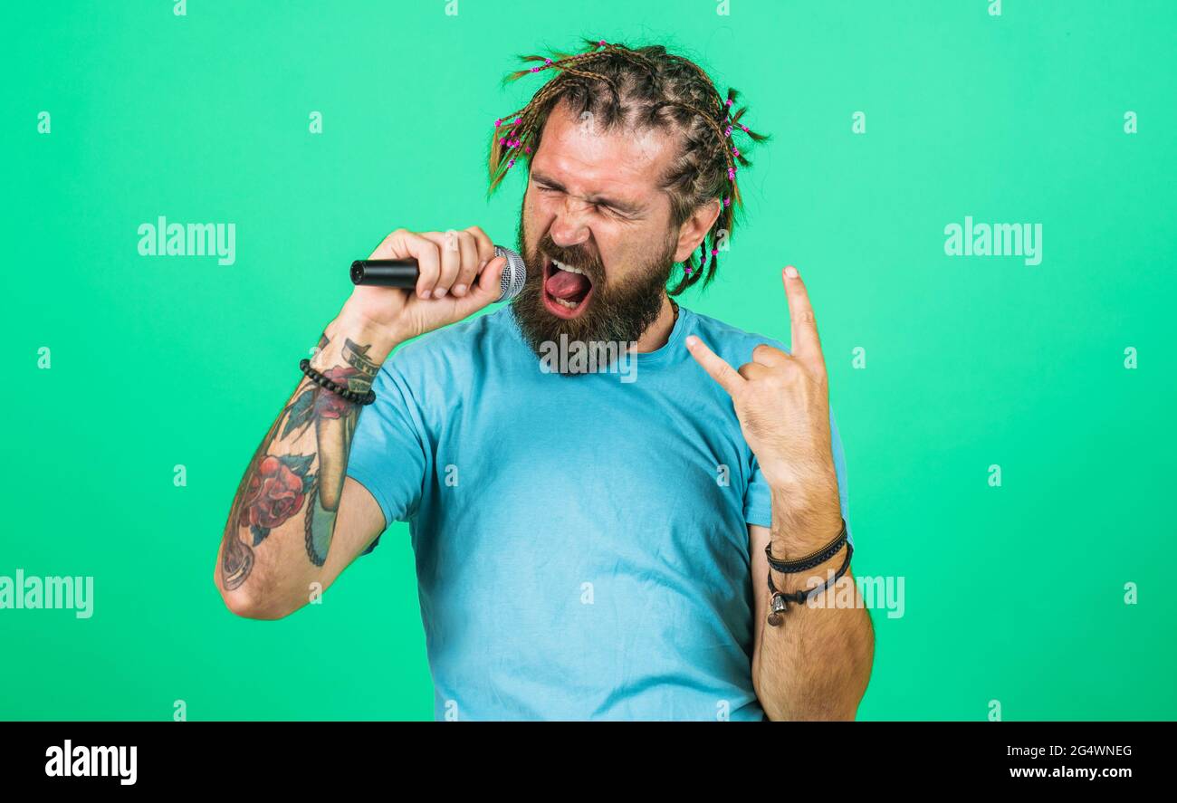 Man singing into microphone hi-res stock photography and images - Alamy
