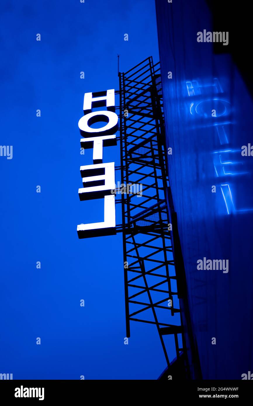 neon light sign and hotel advertisement Stock Photo - Alamy