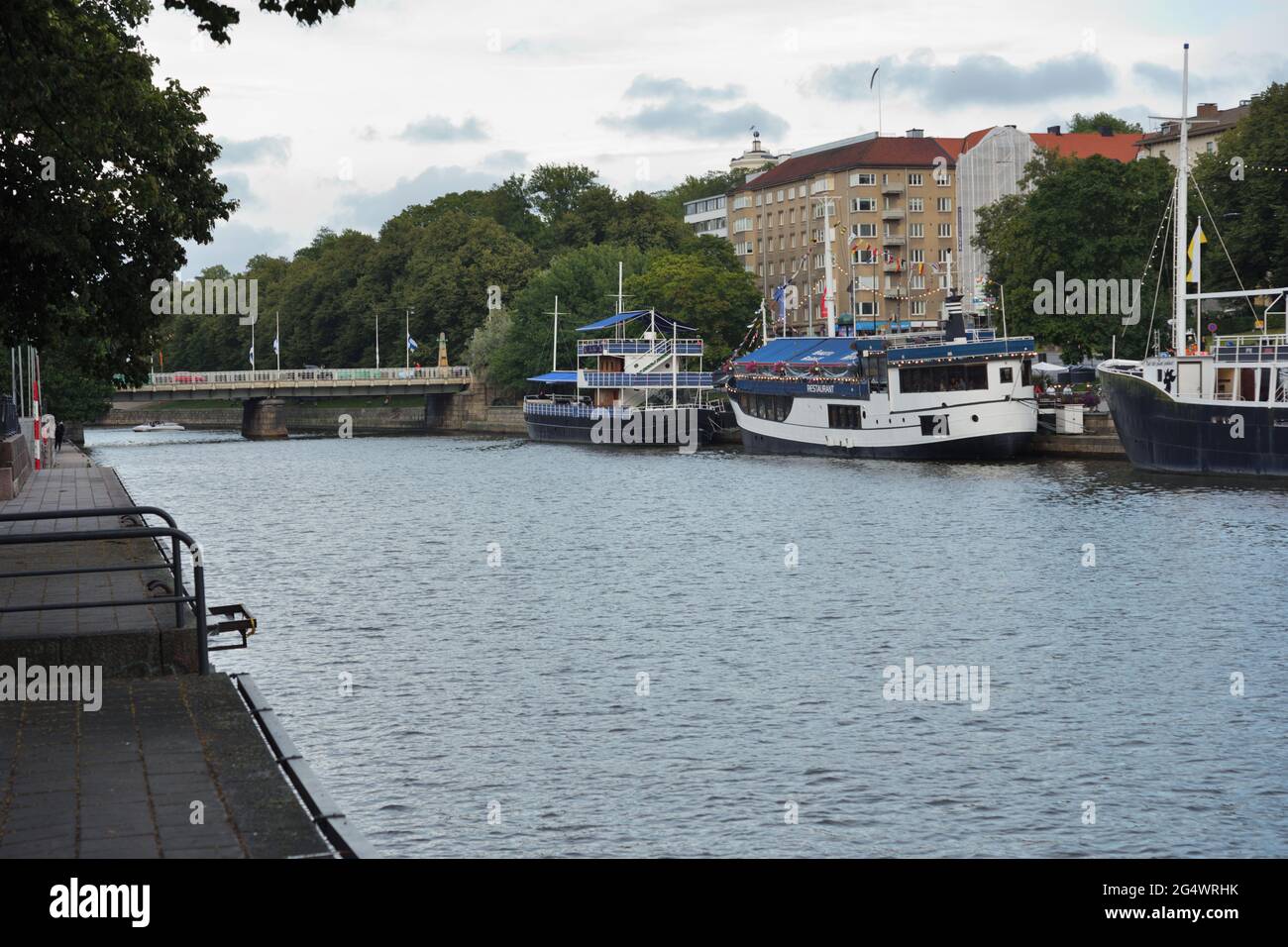 Historical boats and ships moored at the embankment of river Aura in ...