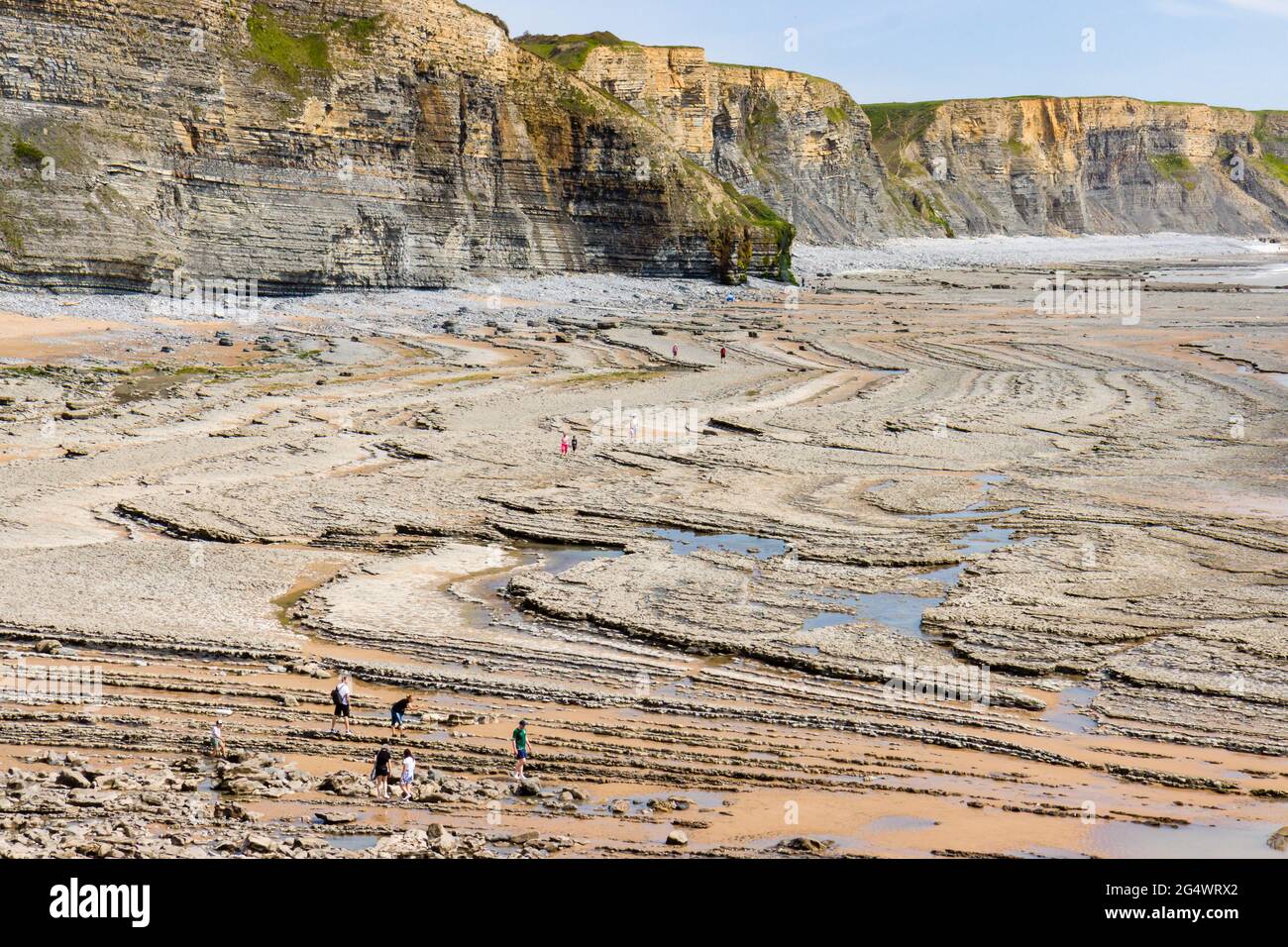 Aerial view of dramatic limestone cliffs and coastline at Southerndown ...