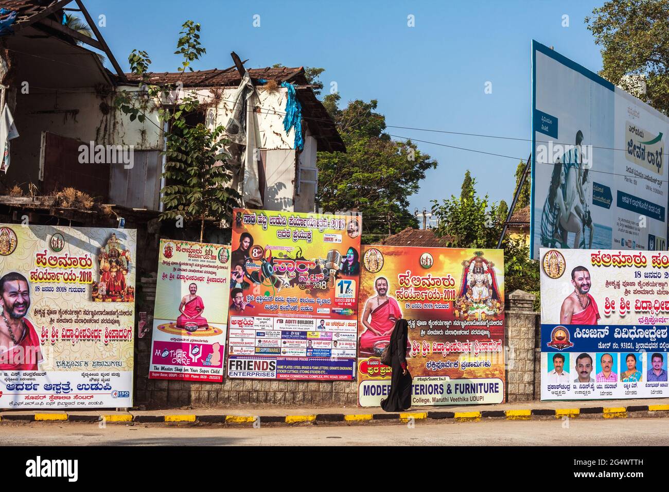 Indian Muslim female wearing full length burqa with niqab passes ...