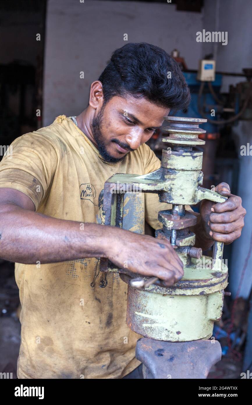 Indian engineer working with lathe in workshop, Udupi, Karnataka, India ...