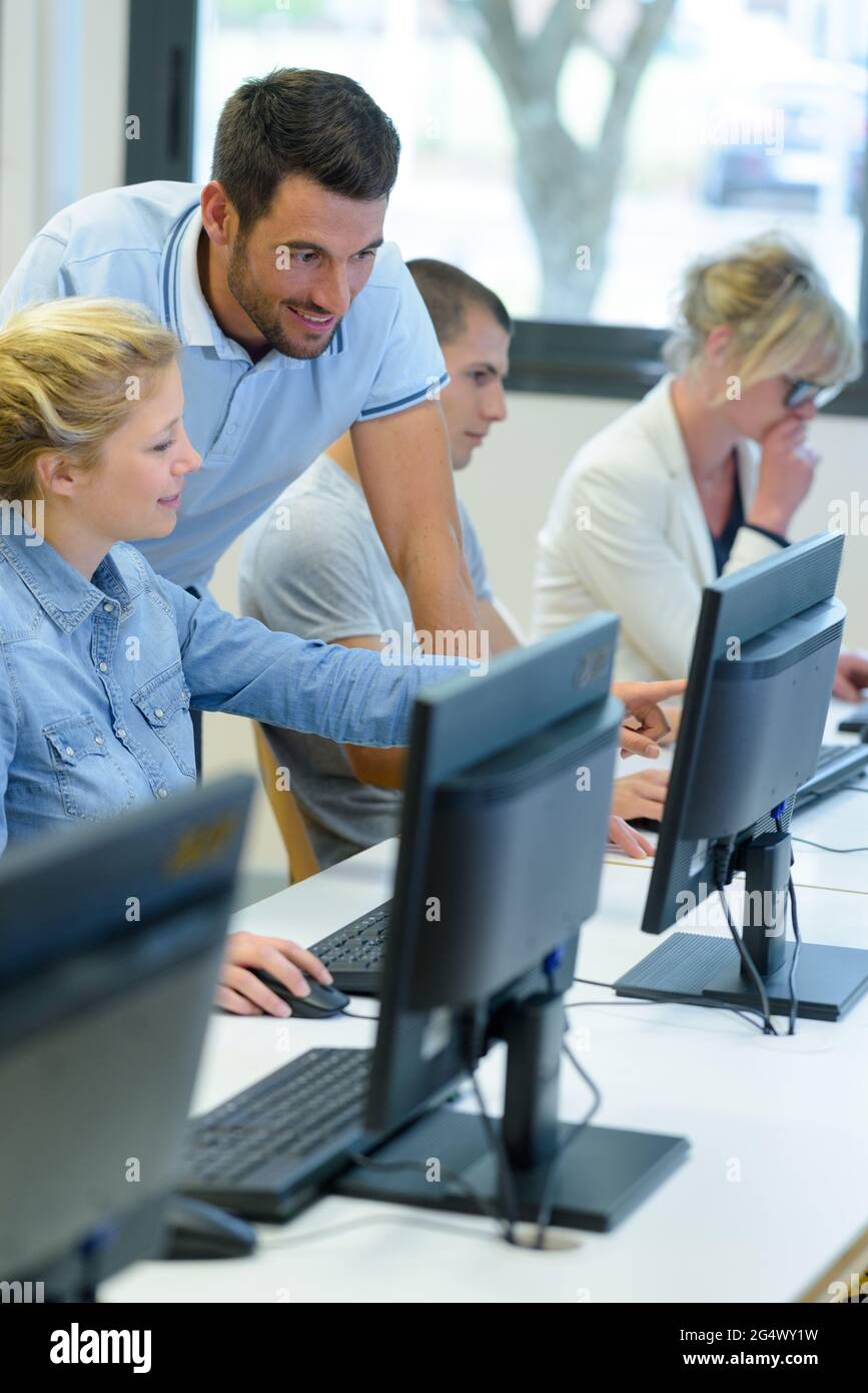 a joyful man teaching students Stock Photo - Alamy