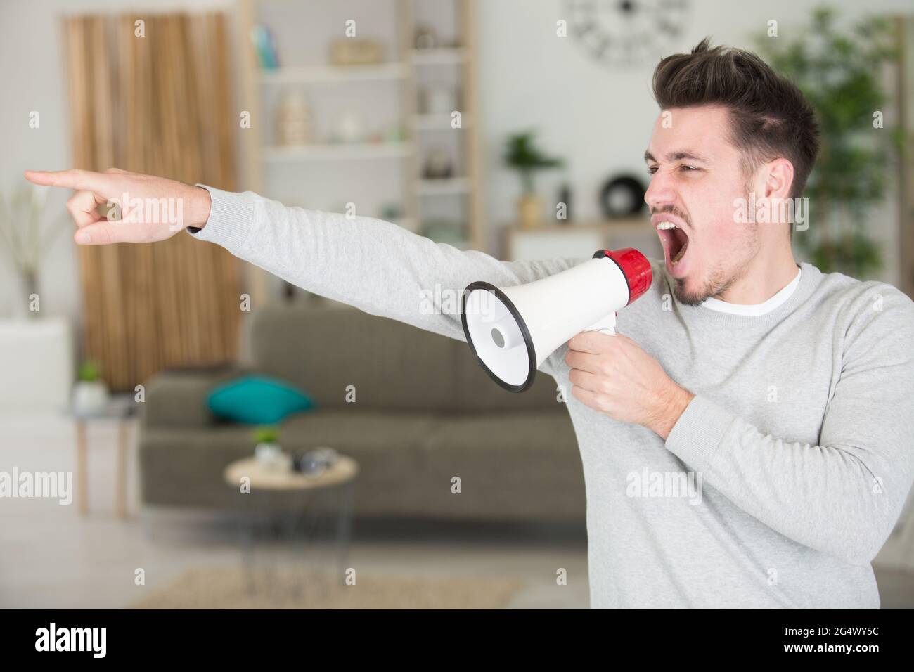 Young businessman loud noise megaphone hi-res stock photography and ...