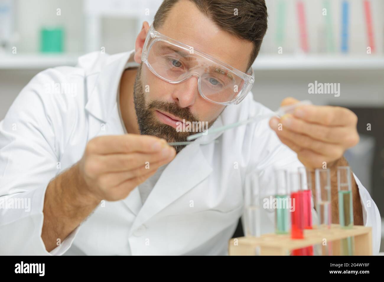 male lab worker during research exercise Stock Photo - Alamy