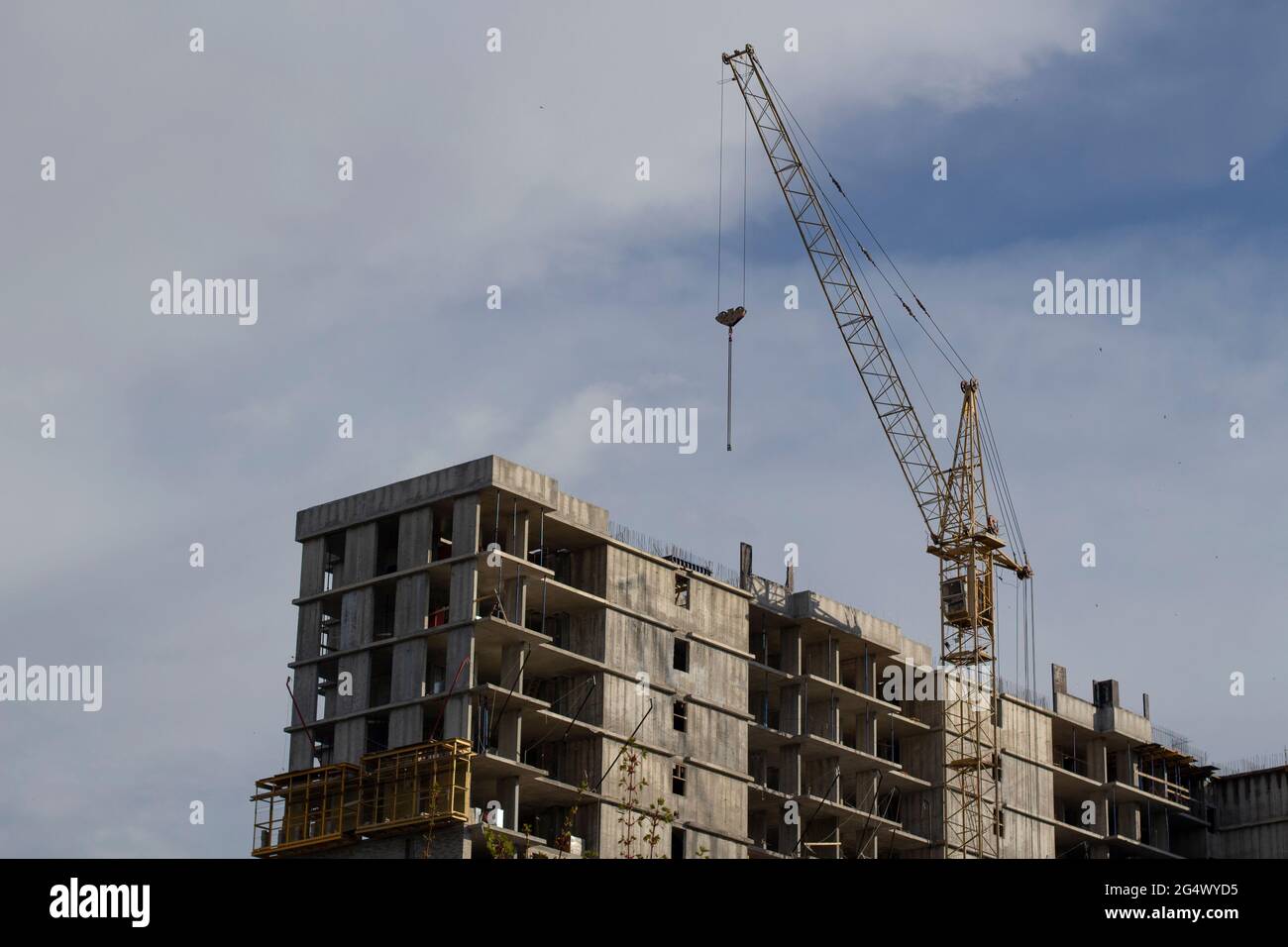 Building a house with a construction crane. Construction of an ...