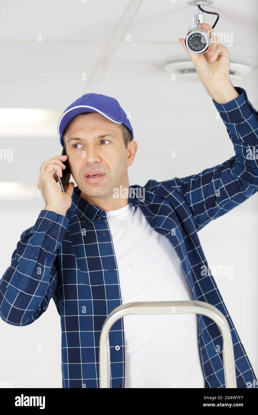 handsome cctv guy with tools and security camera Stock Photo - Alamy