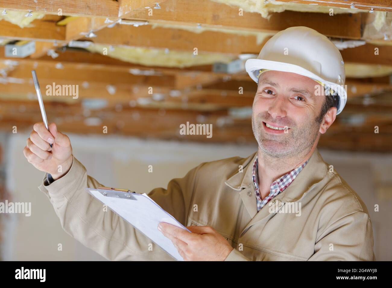 writing builder with construction tools Stock Photo - Alamy