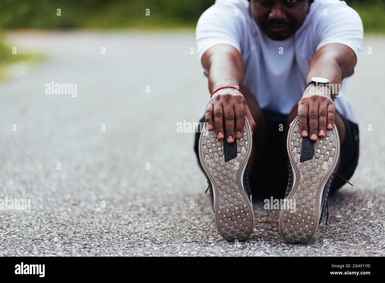 Close up Asian young athlete sport runner black man wear watch he ...