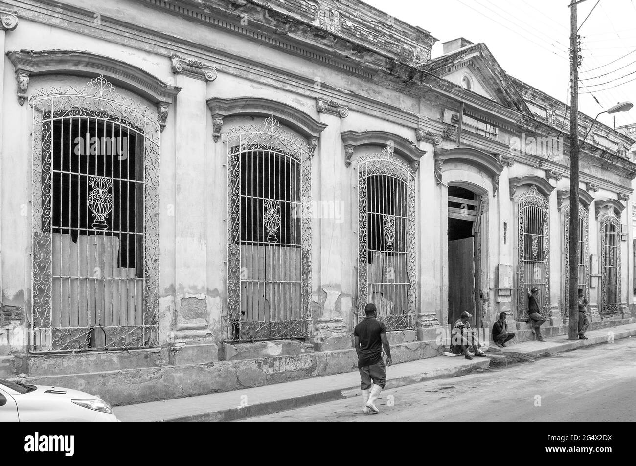 Cuban construction workers waiting for materials to arrive at the Santa ...