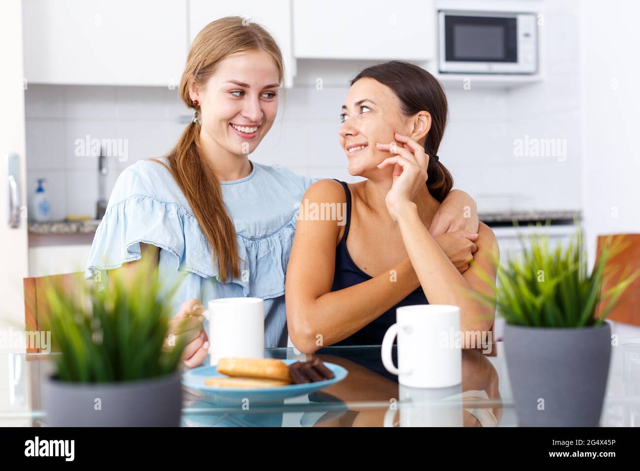 Portrait of two young friendly women Stock Photo - Alamy