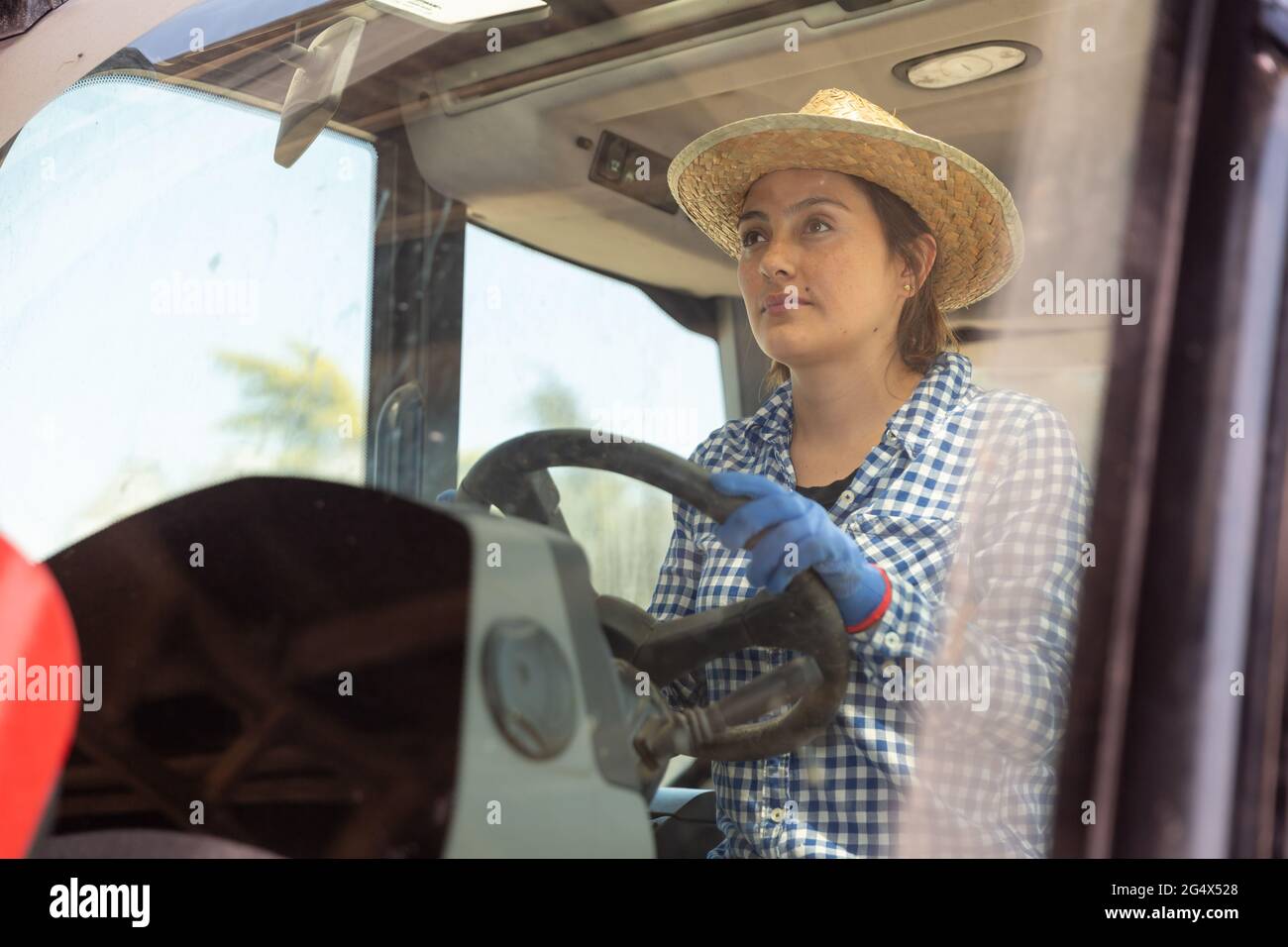 Woman driving tractor cabin hi-res stock photography and images - Alamy