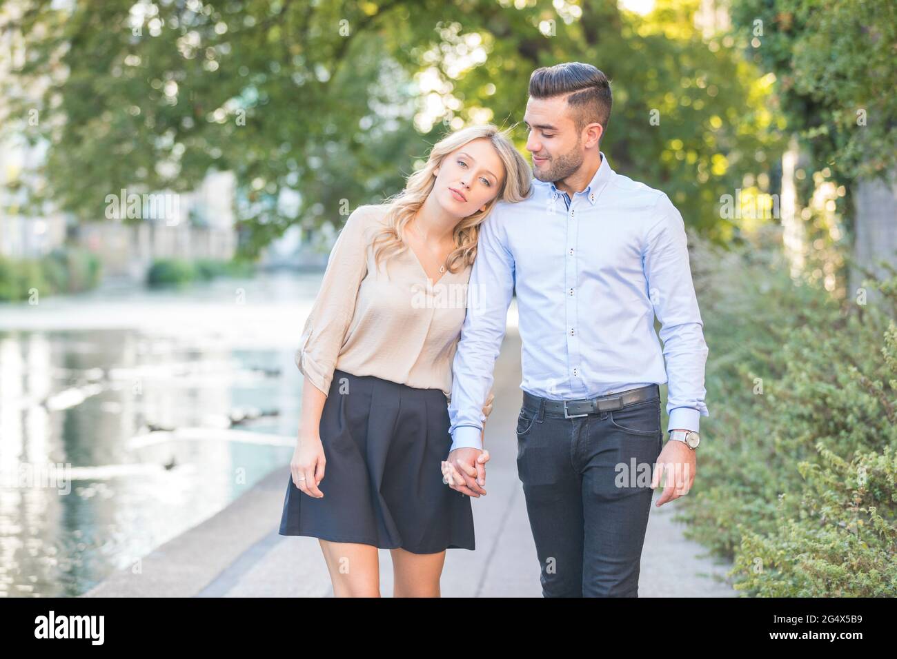 Couple walking on promenade hi-res stock photography and images - Alamy