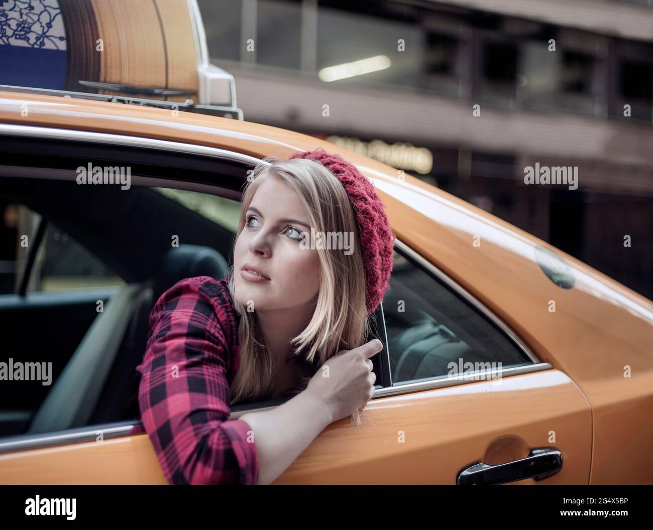 Beautiful woman wearing beret looking away through taxi window Stock ...