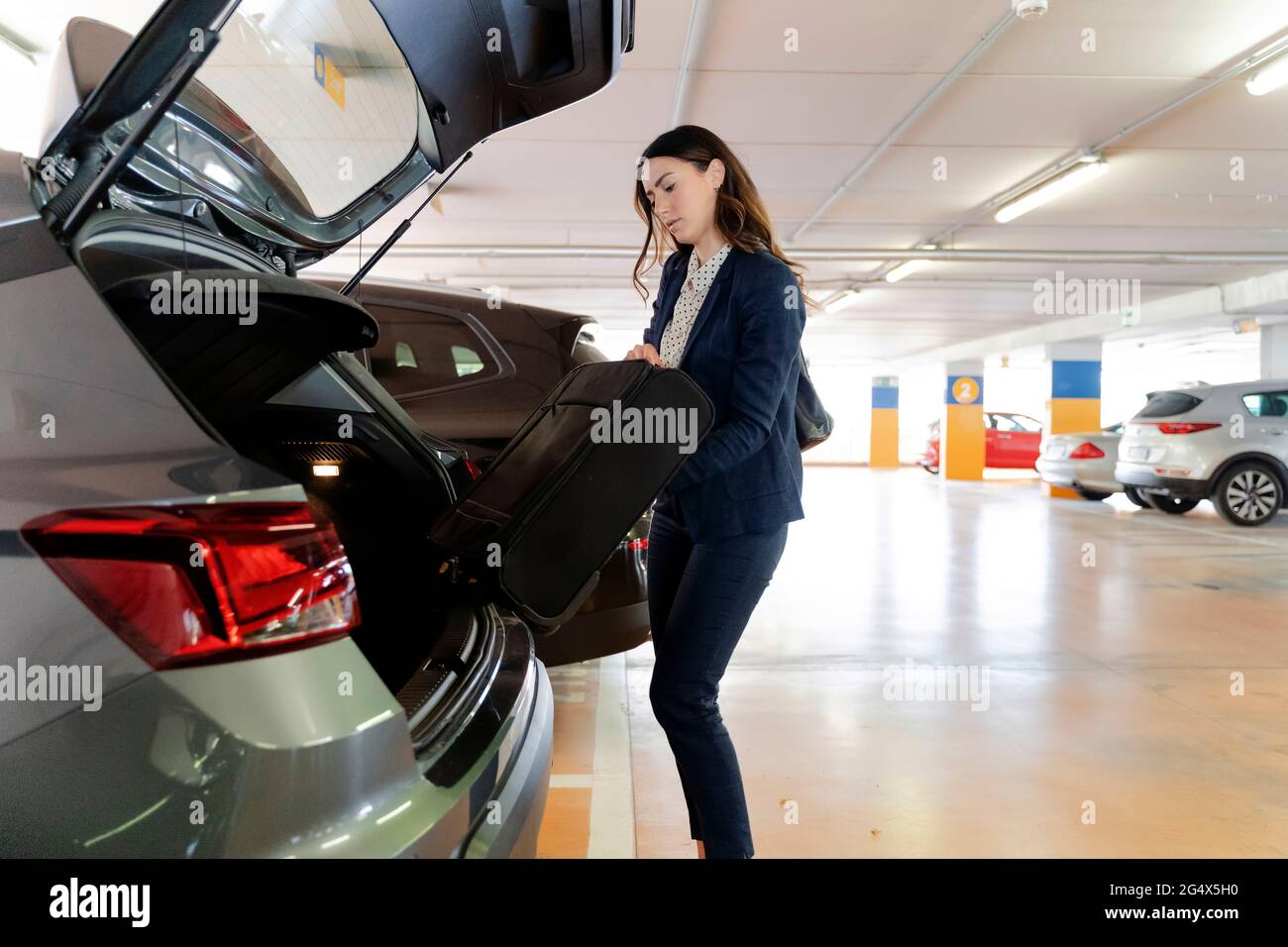 Business people unloading suitcase car hi-res stock photography and ...