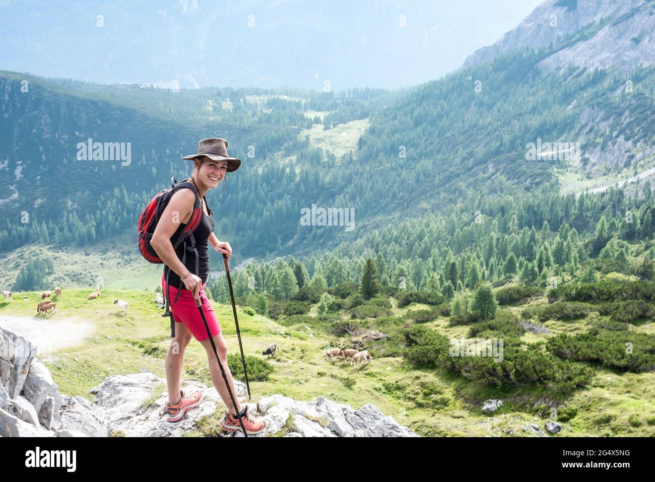 Woman standing on rock hi-res stock photography and images - Alamy