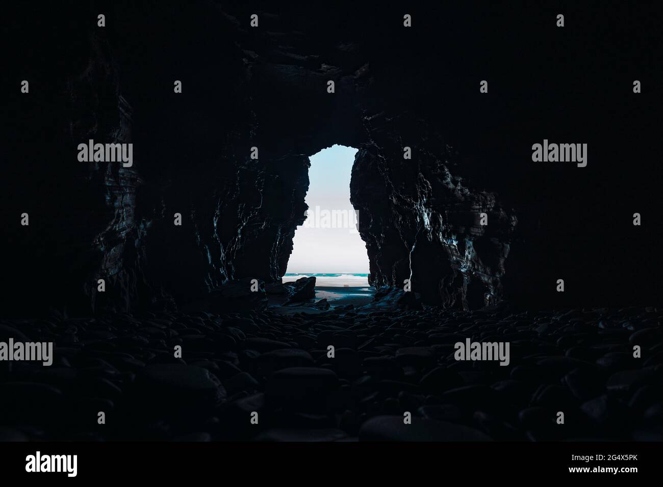 Interior of dark cave at Beach of Cathedrals Stock Photo - Alamy