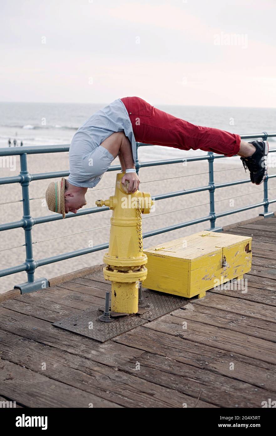 Young man balancing on railing hi-res stock photography and images - Alamy