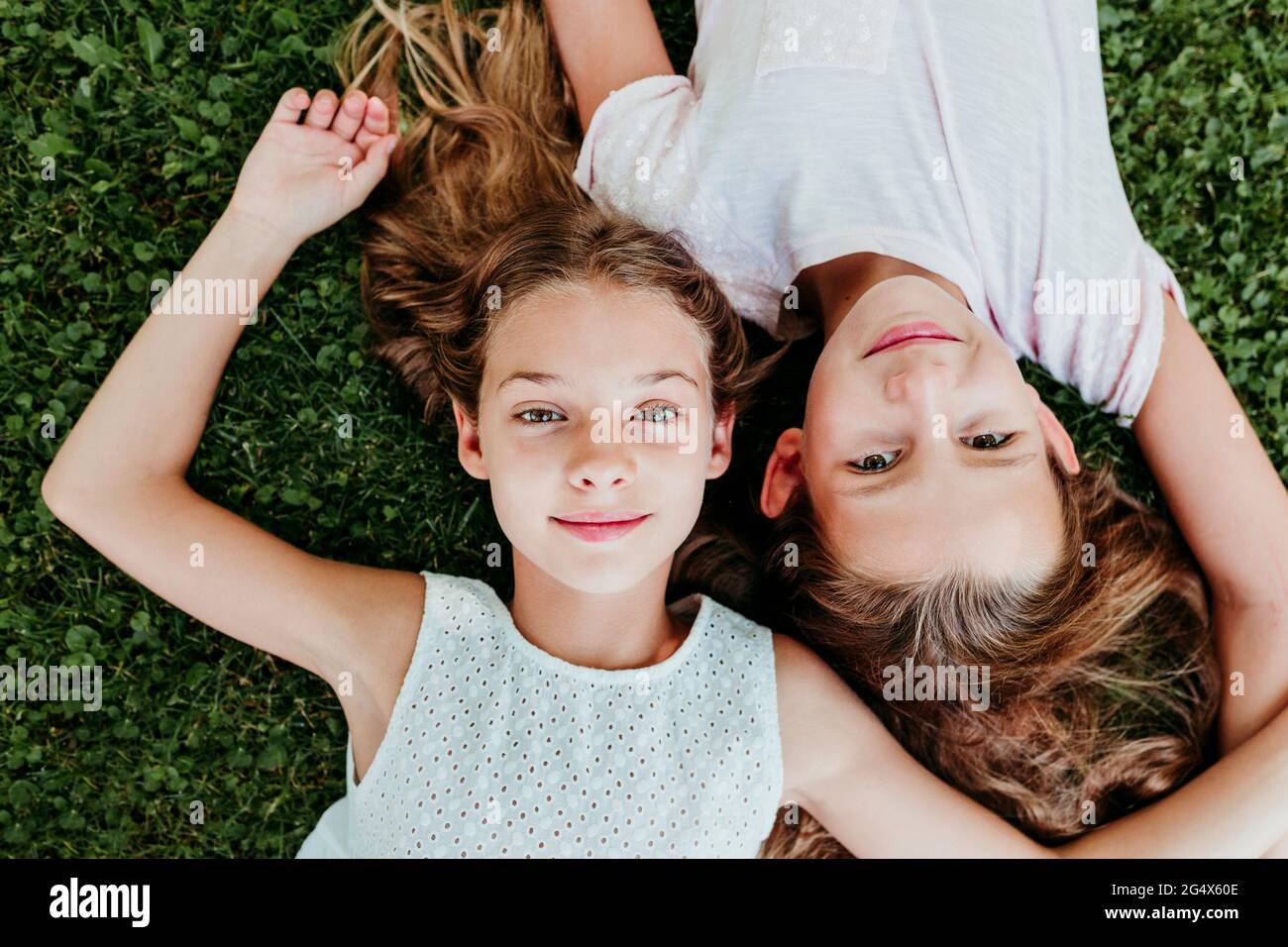 Smiling friends lying in hi-res stock photography and images - Alamy