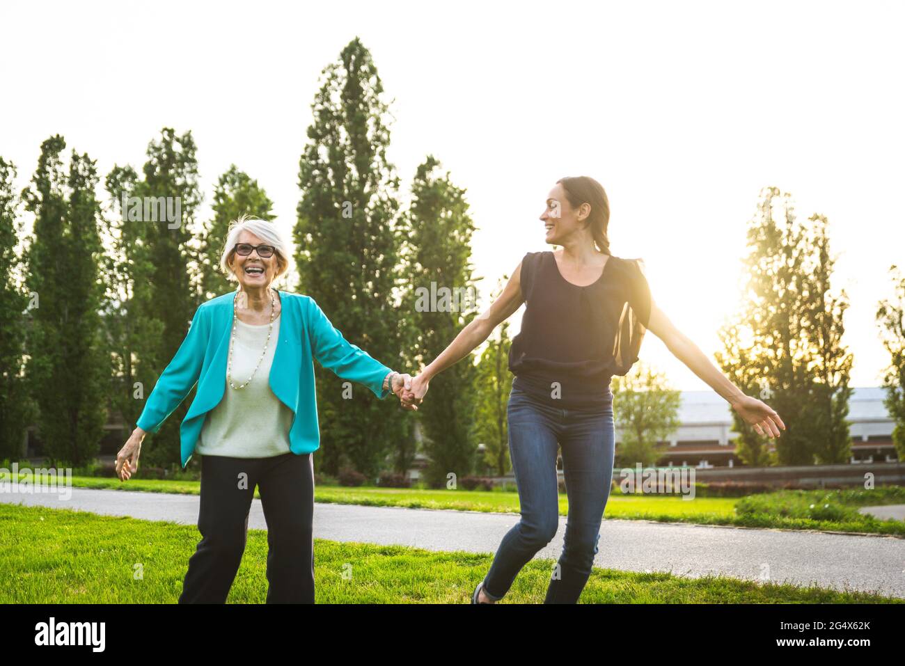 Playing holding hands hi-res stock photography and images - Alamy