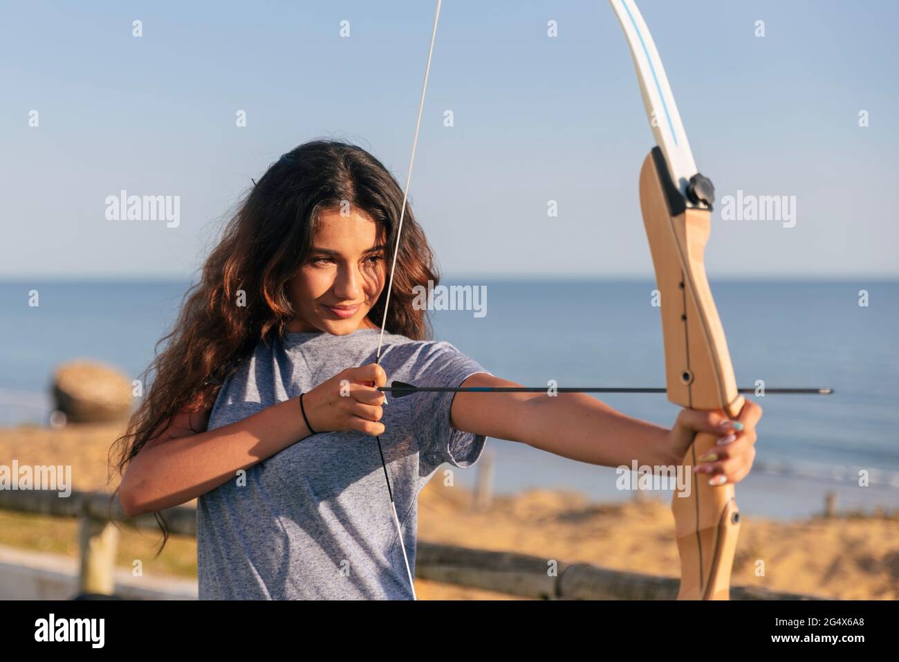 Young female archer practicing archery hi-res stock photography and ...