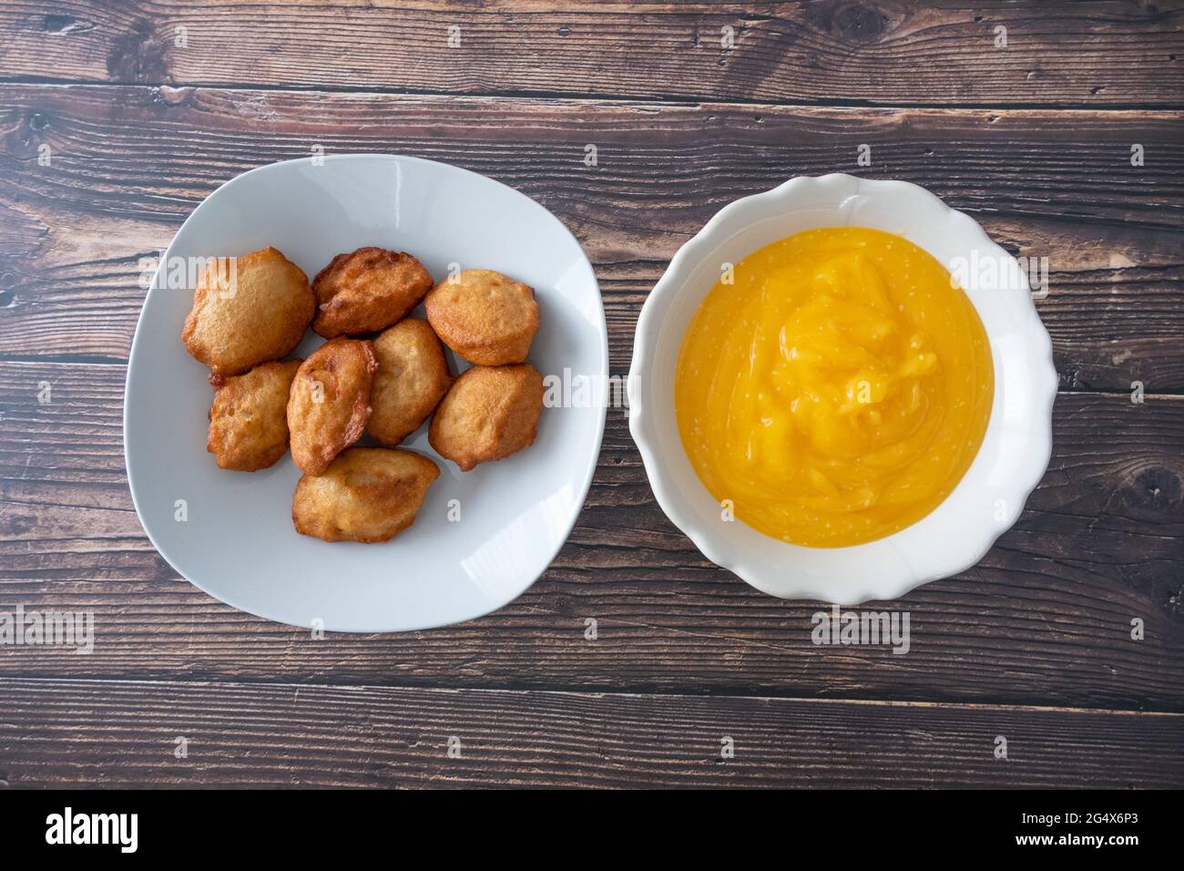 Nigerian Deep Fried Akara beancake served with Custard Stock Photo - Alamy