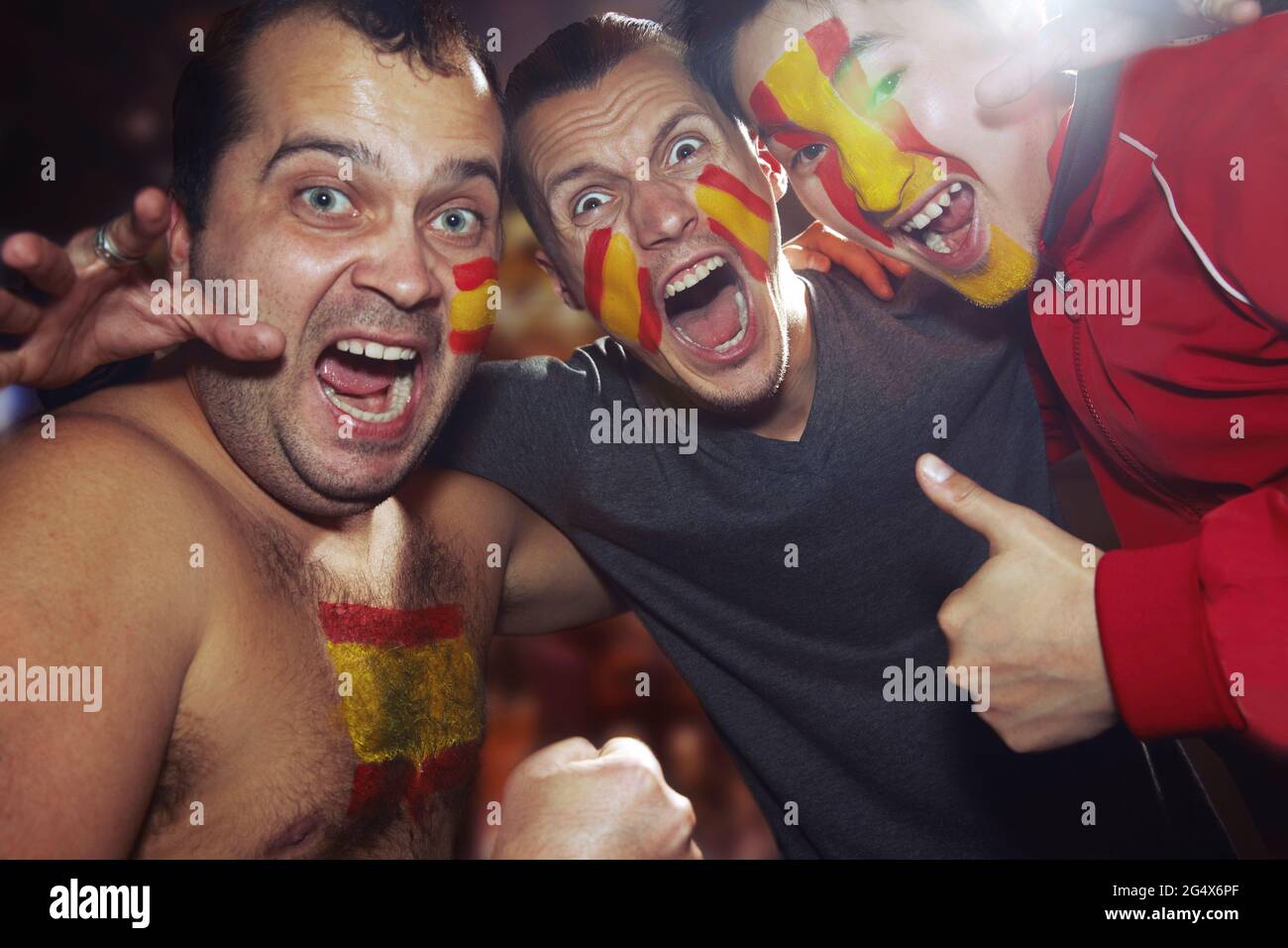 Male sports fan with Spanish flag paint on face Stock Photo - Alamy