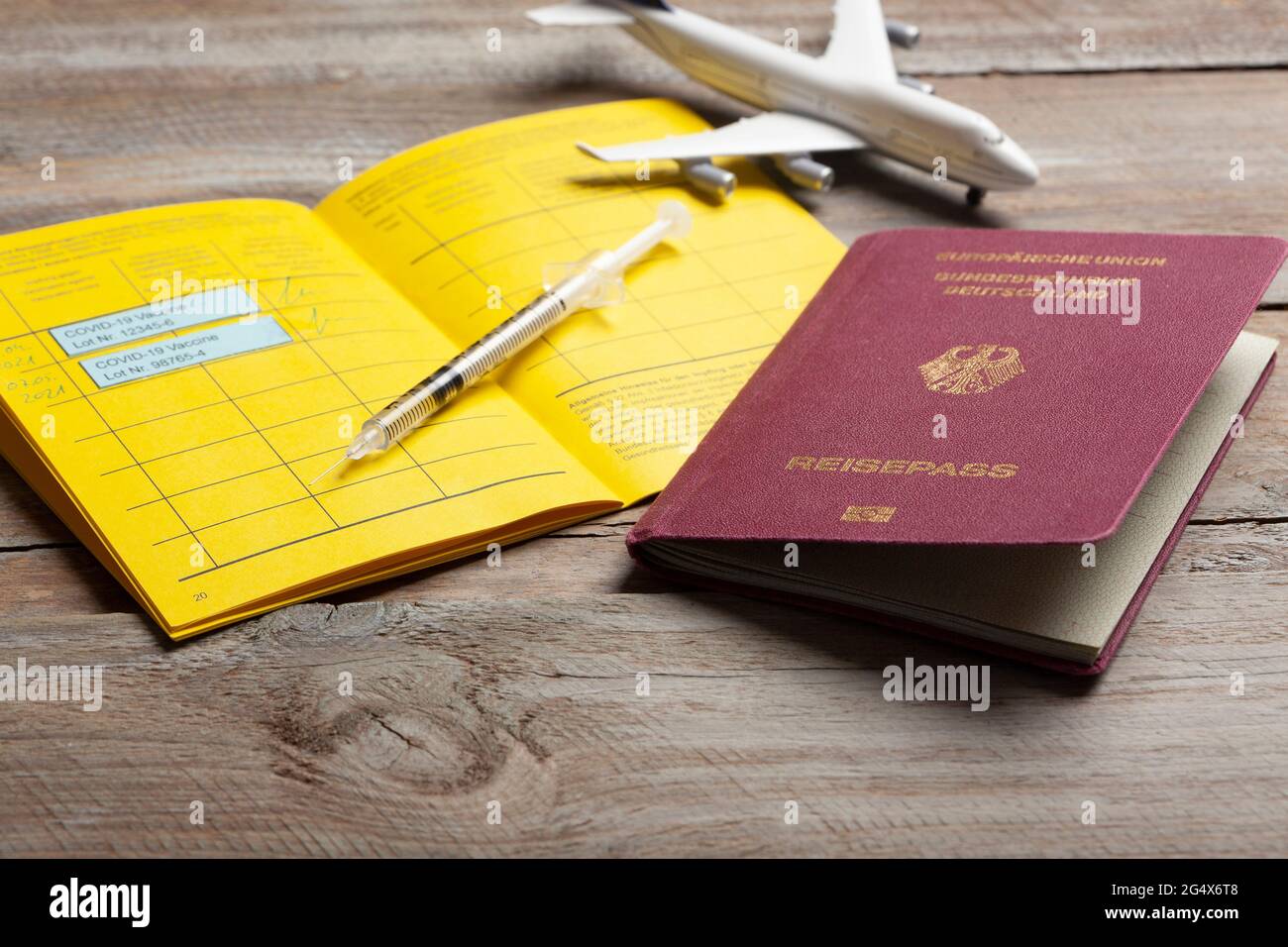 Travel pass with coronavirus immunization certificate on table Stock ...