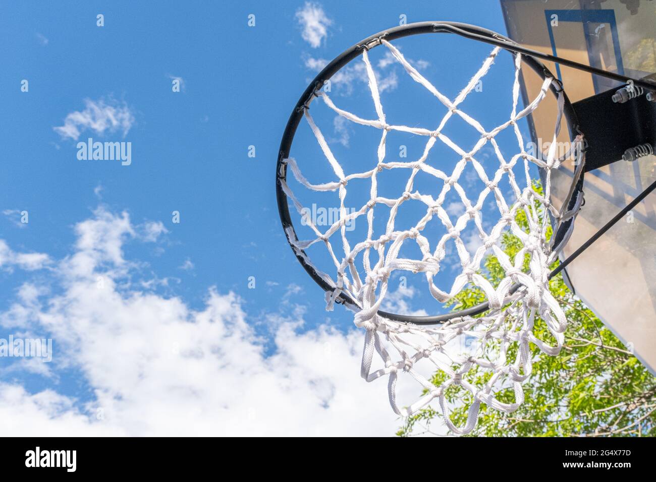 Basketball hoop outside in summer on driveway Stock Photo - Alamy