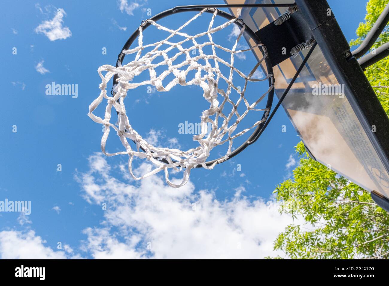 Basketball hoop outside in summer on driveway Stock Photo - Alamy