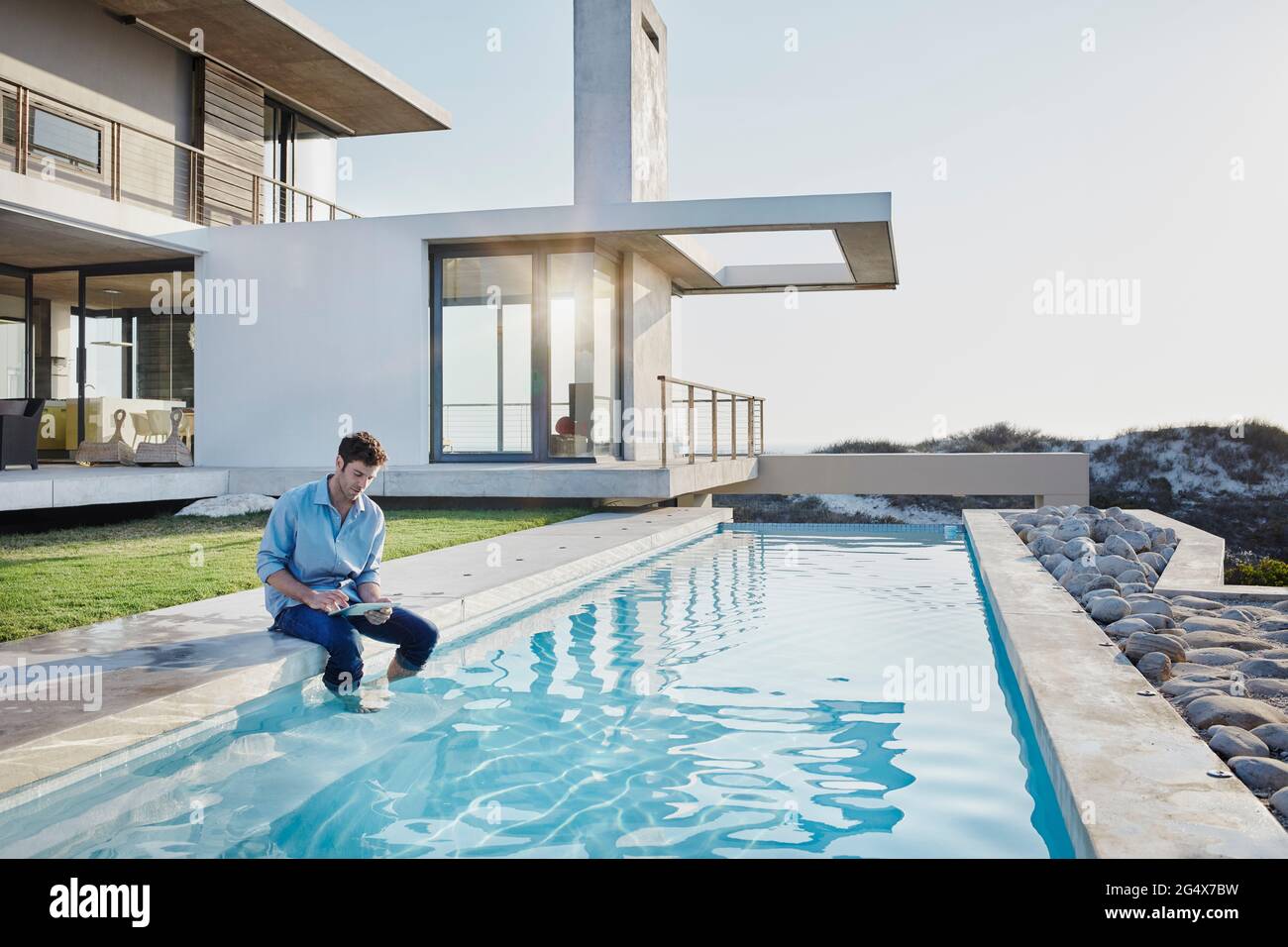 Using computer in swimming pool hi-res stock photography and images - Alamy