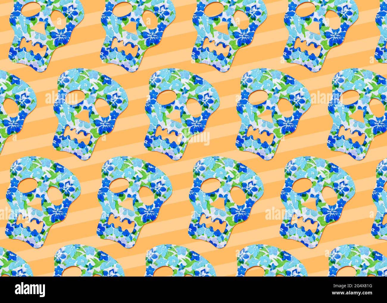 Pattern of rows of blue skull masks decorated with floral print Stock ...