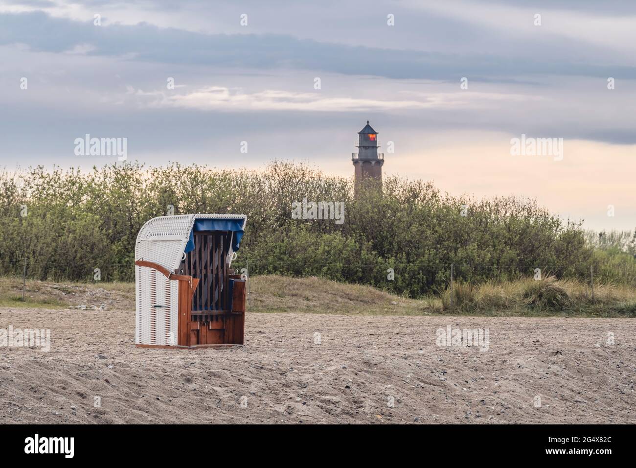 Hooded beach chair standing on empty beach at dusk with Neuland ...