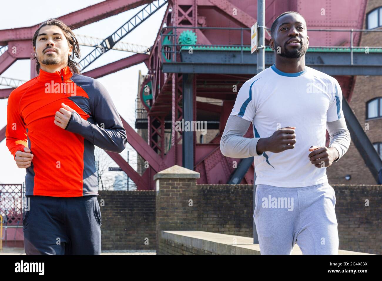 Three friends jogging together hi-res stock photography and images - Alamy