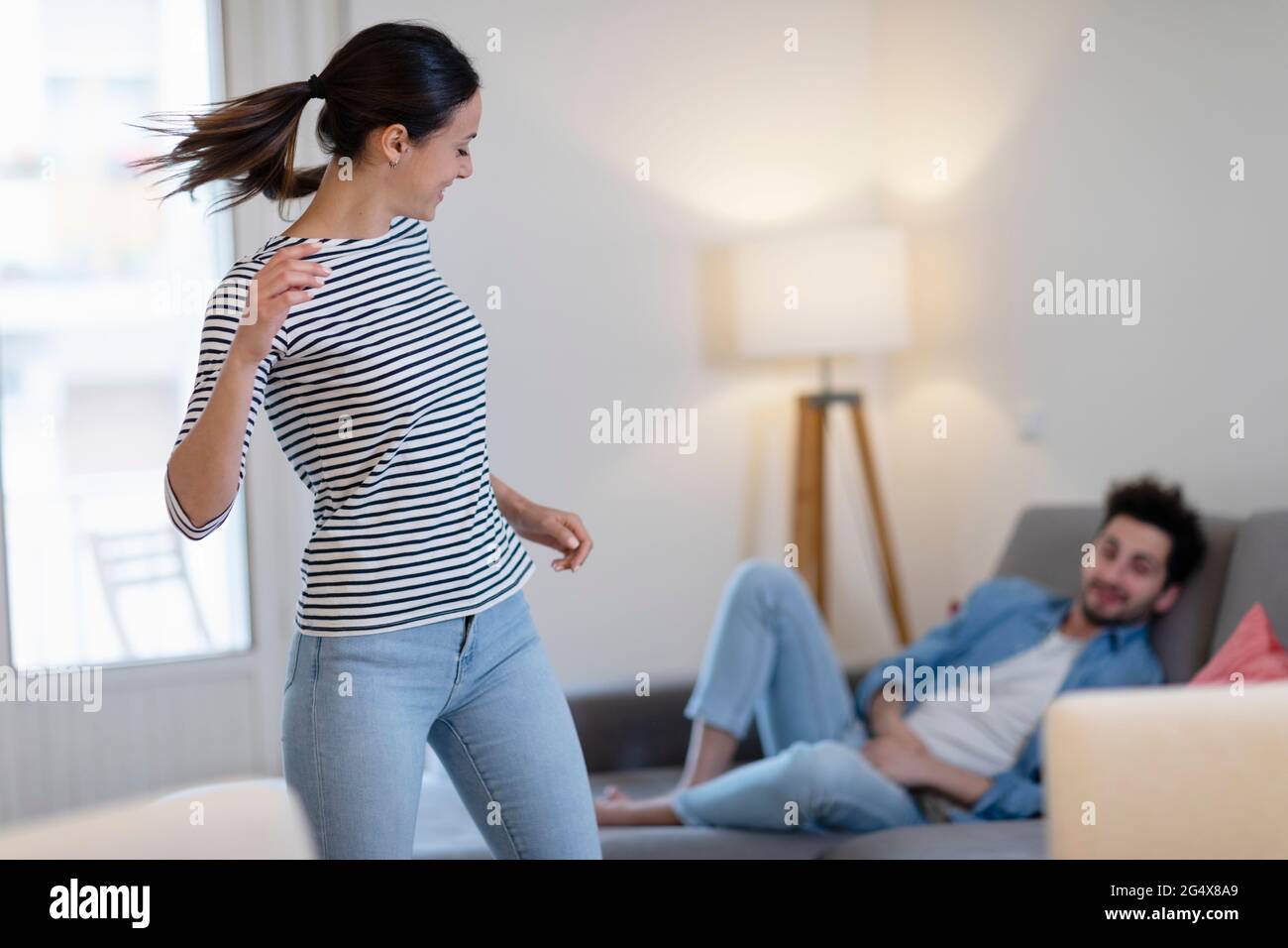 Woman dancing on couch hi-res stock photography and images - Alamy