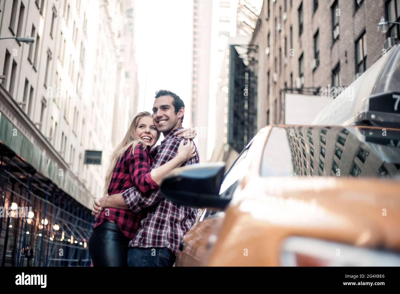 Excited couple embracing while exploring New York City Stock Photo - Alamy