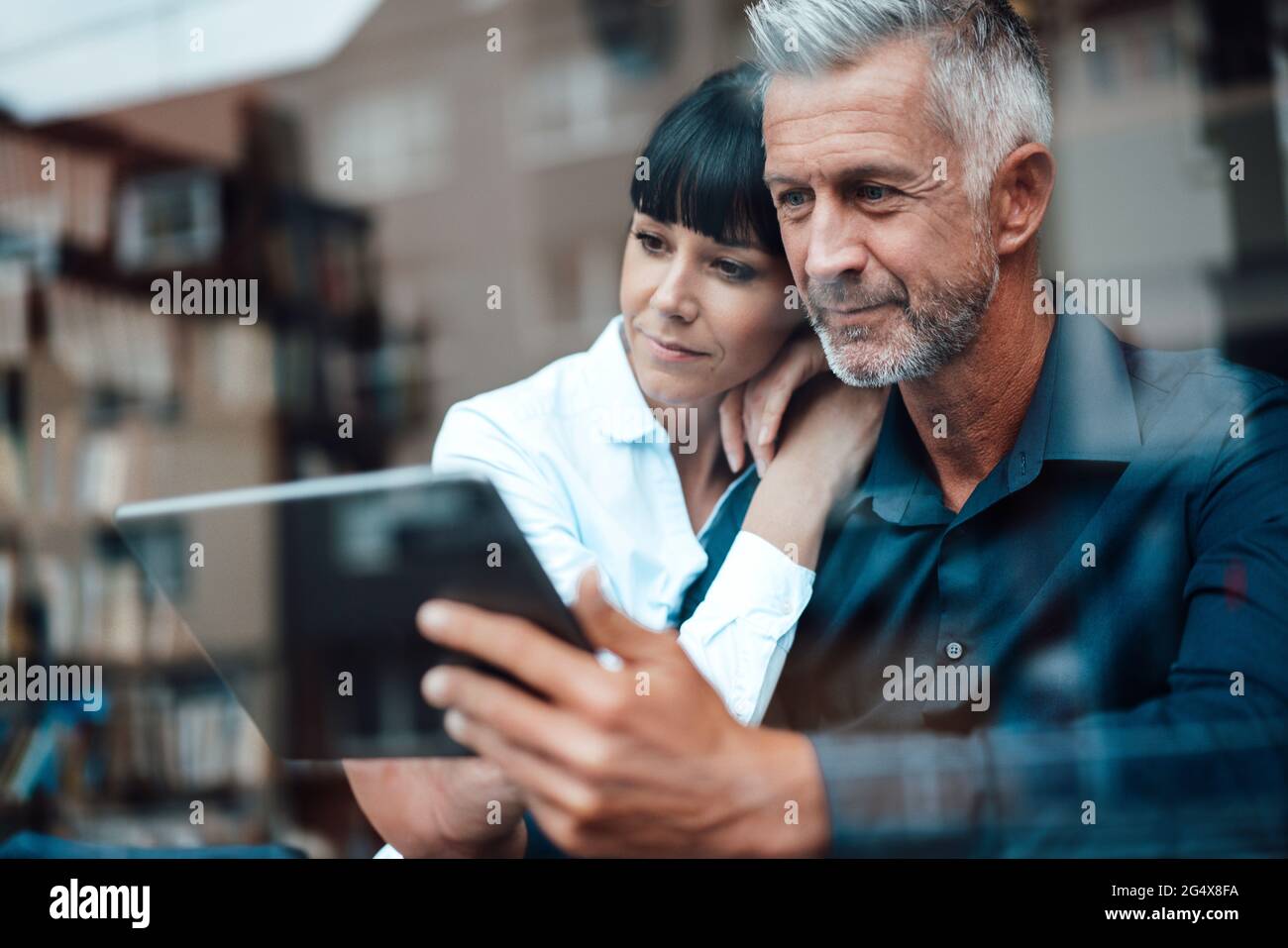 Business people using tablet together hi-res stock photography and ...