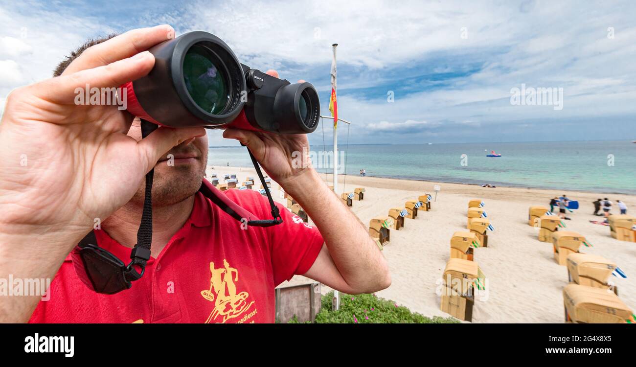 Timmndorfer Strand, Germany. 23rd June, 2021. A lifeguard of the German ...