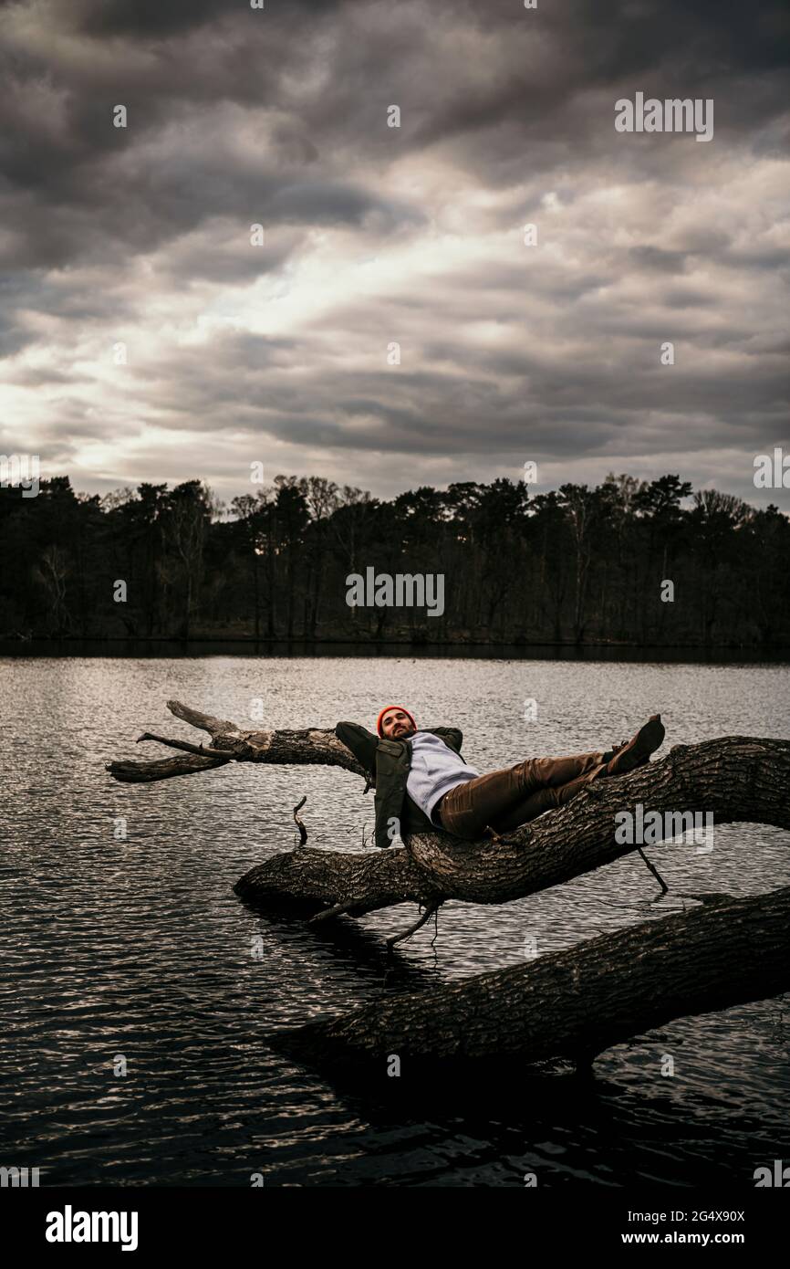 Man lying on fallen tree hi-res stock photography and images - Alamy