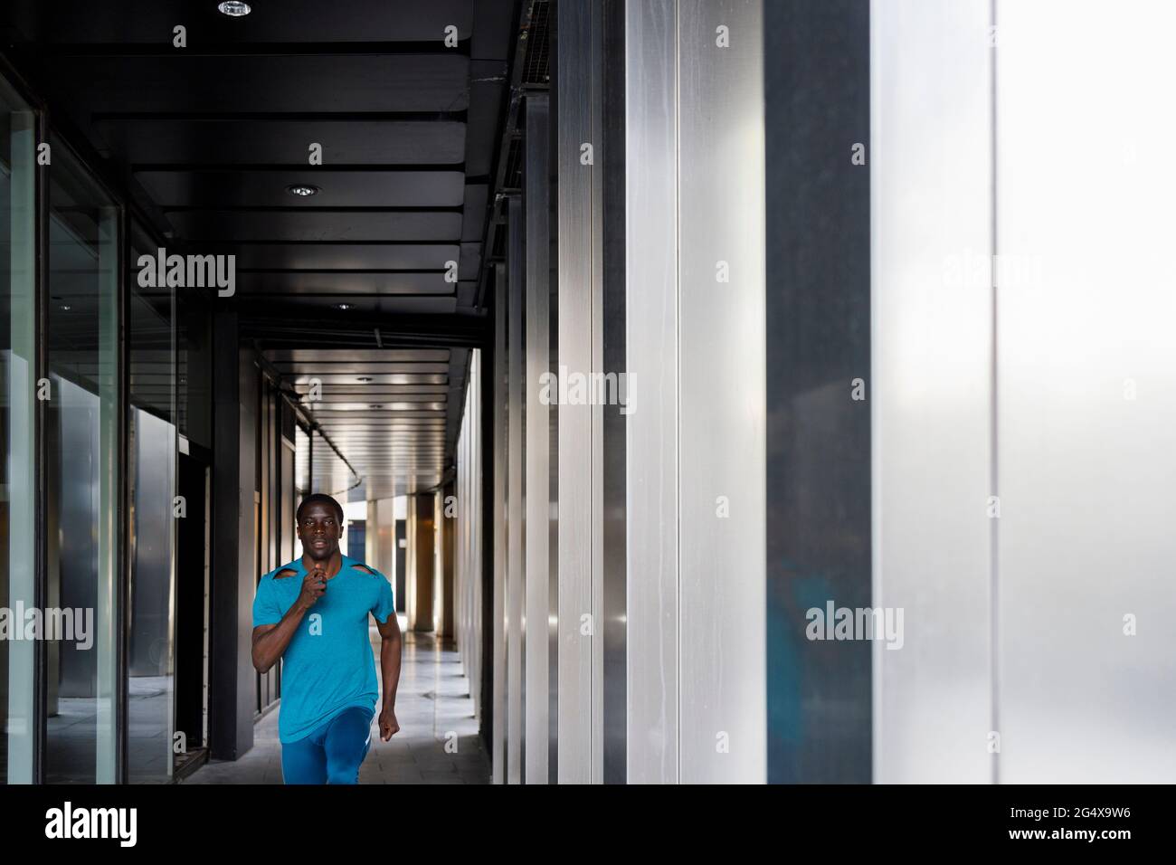 Male running indoors not gym hi-res stock photography and images - Alamy