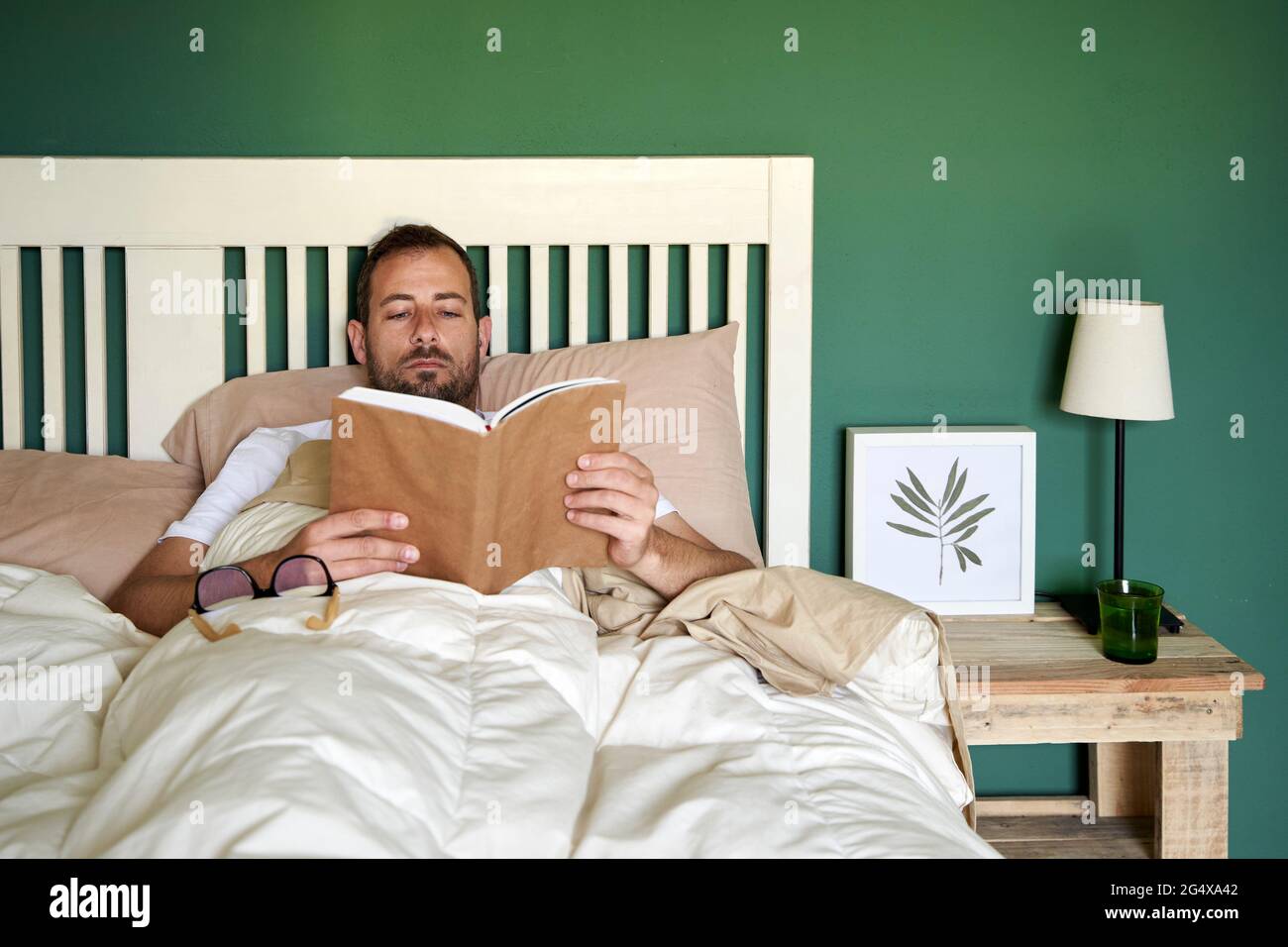 Adult male reading book hi-res stock photography and images - Alamy