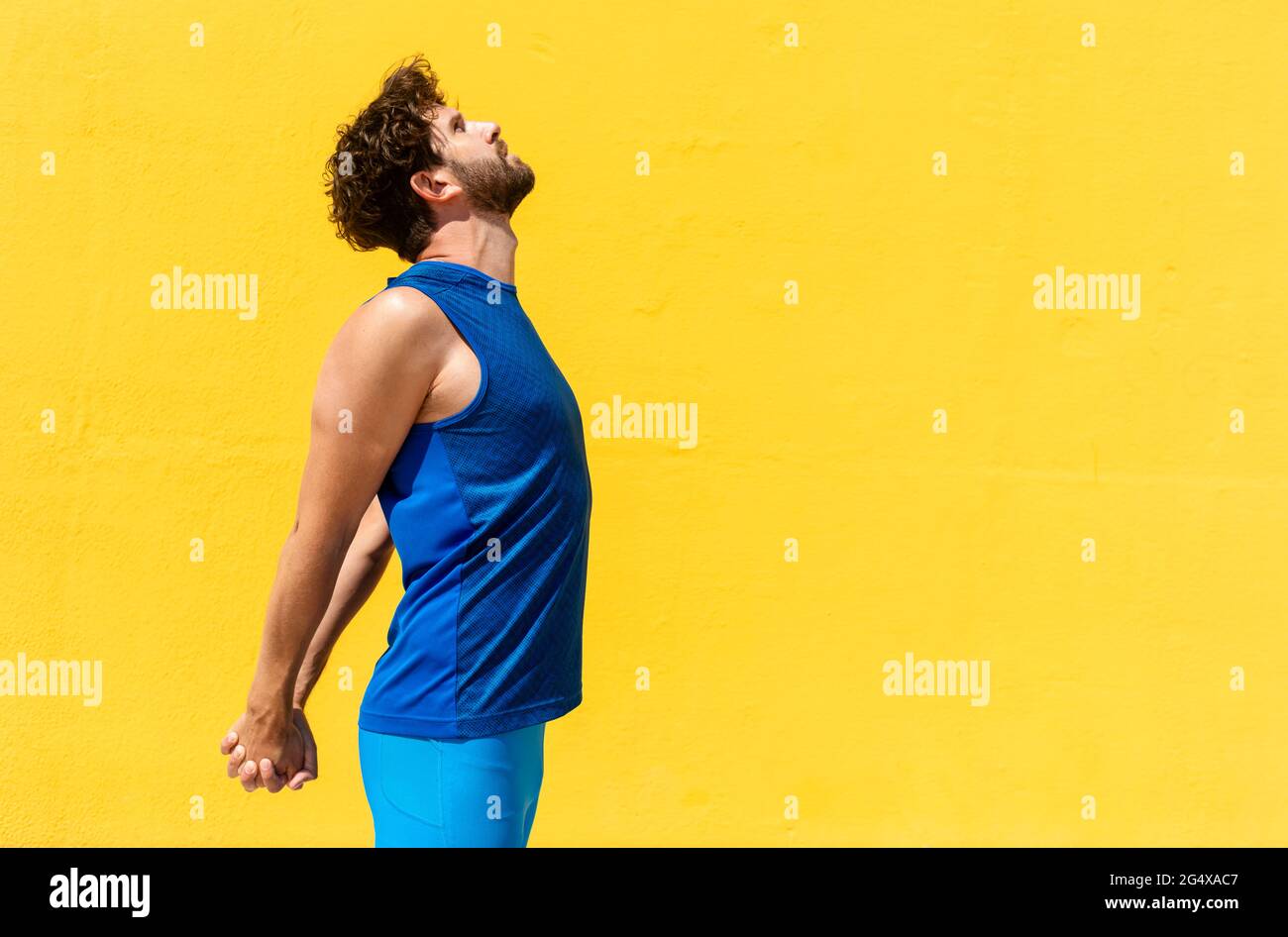 Back view of man doing stretching hi-res stock photography and images ...