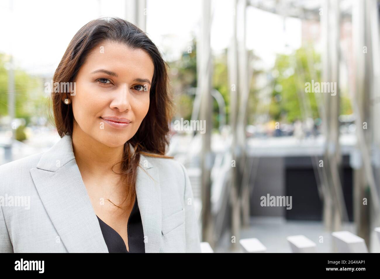Female entrepreneur smiling Stock Photo - Alamy
